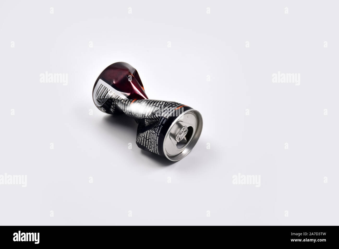 Crumpled aluminum can on a white background Stock Photo - Alamy