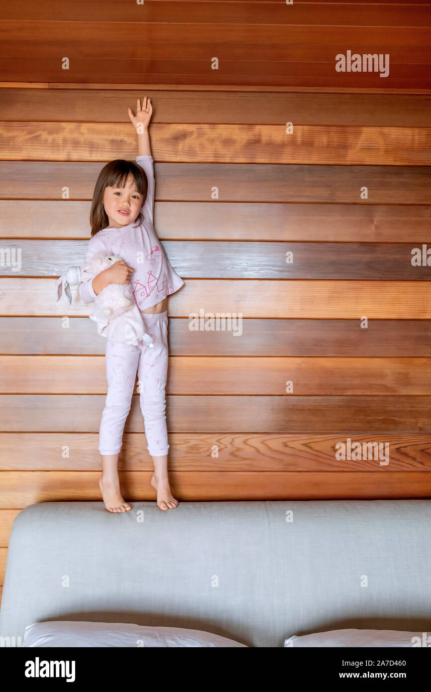 Five year old reaching up high Stock Photo - Alamy