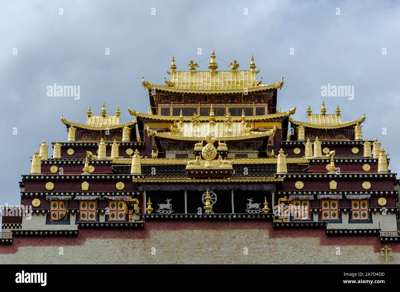 Monks walking outside the The Ganden Sumtseling Monastery, Shangri-La ...