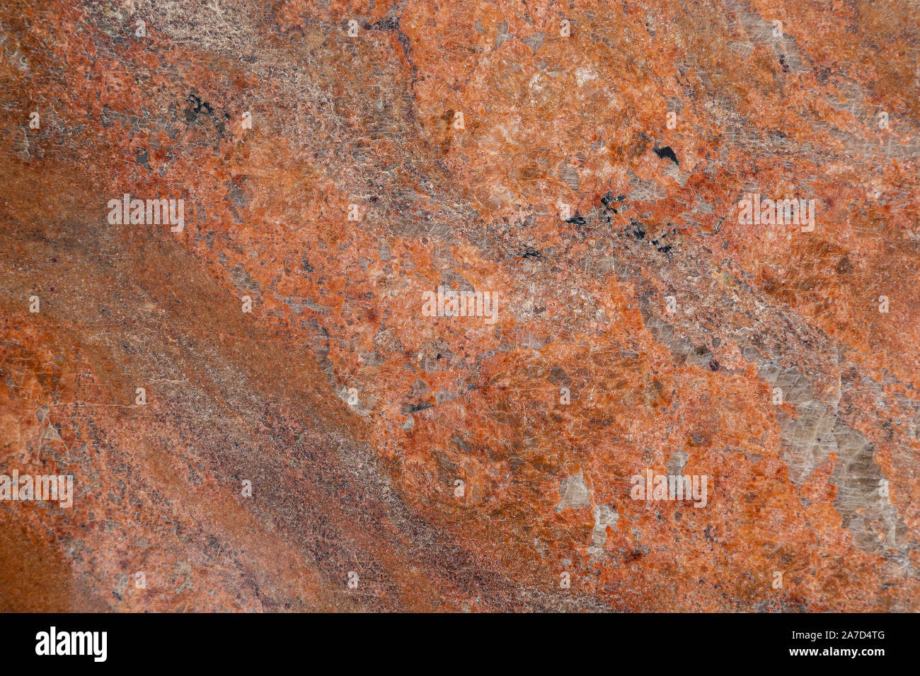 Elevated view of red-orange granite stone surface Stock Photo - Alamy