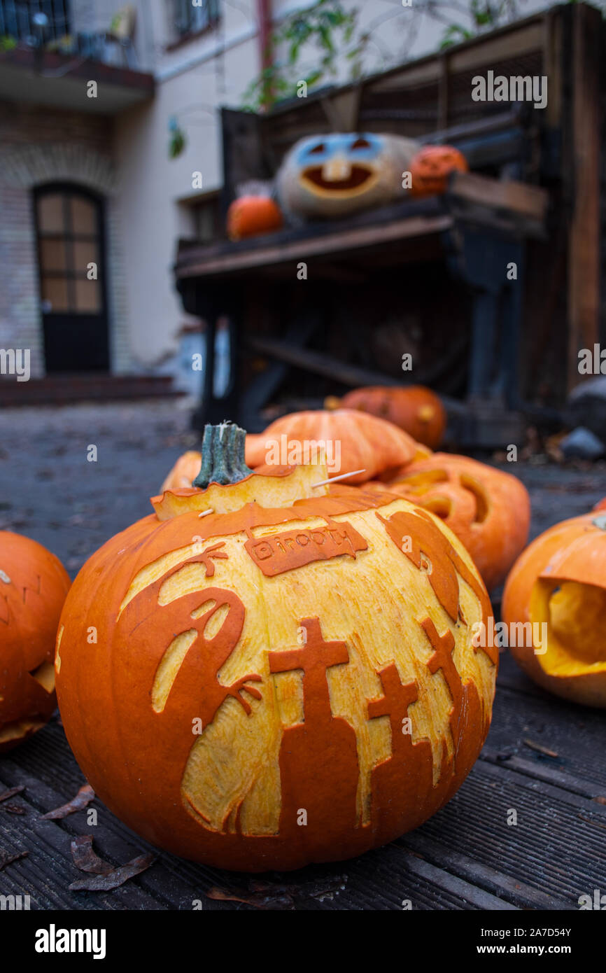 Spooky Halloween pumpkins with drawings of ghost, crosses and devil on ...