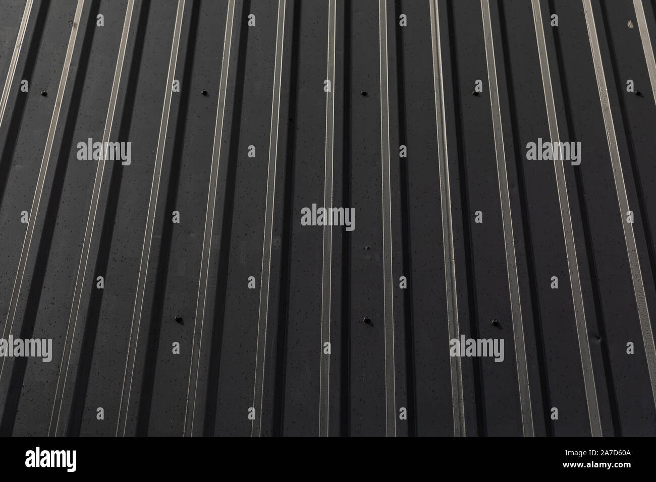 Front view of straight lines on black corrugated surface Stock Photo ...
