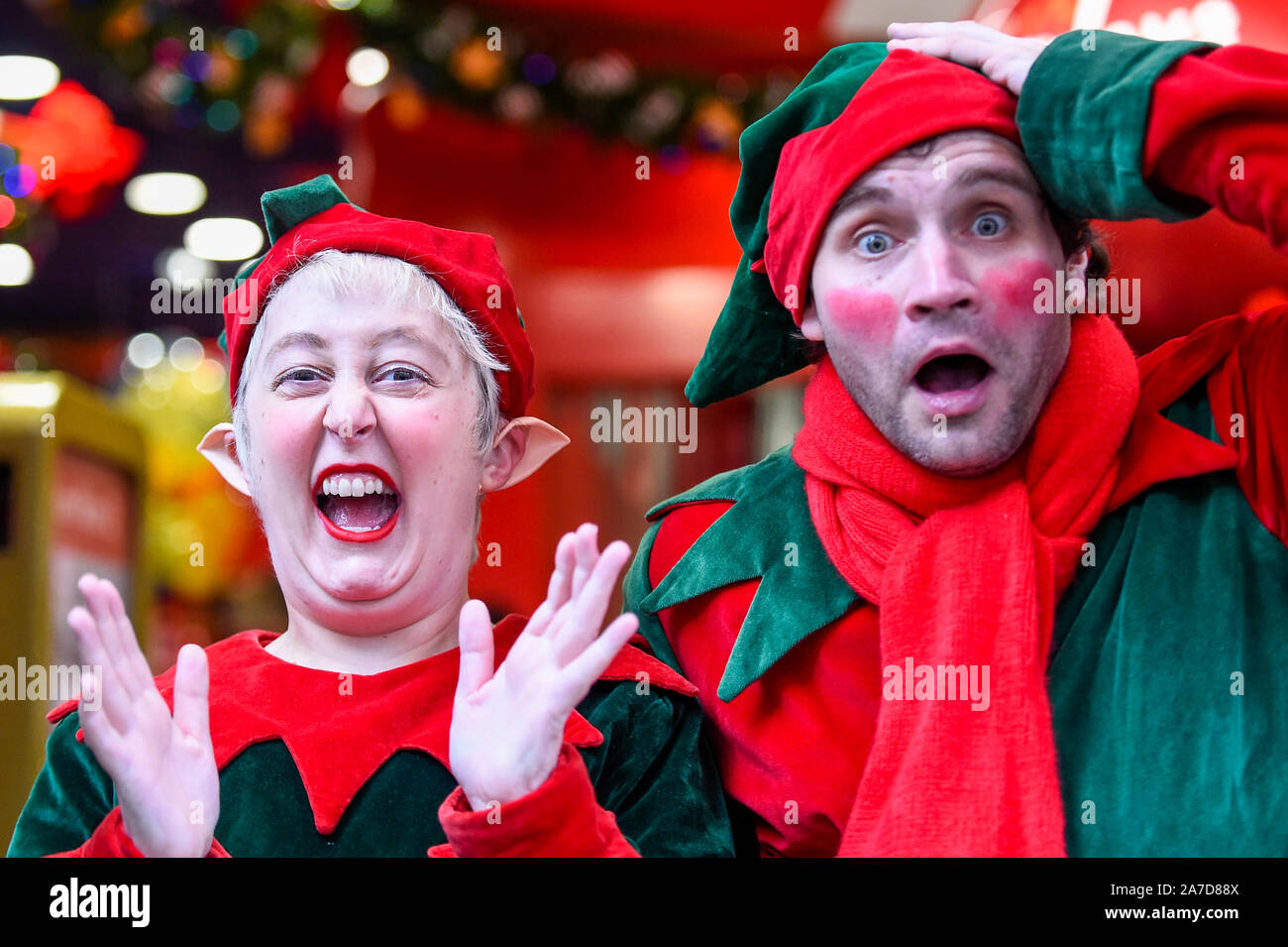 London, UK. 1 November 2019. Staff dressed as elves entertain passers ...