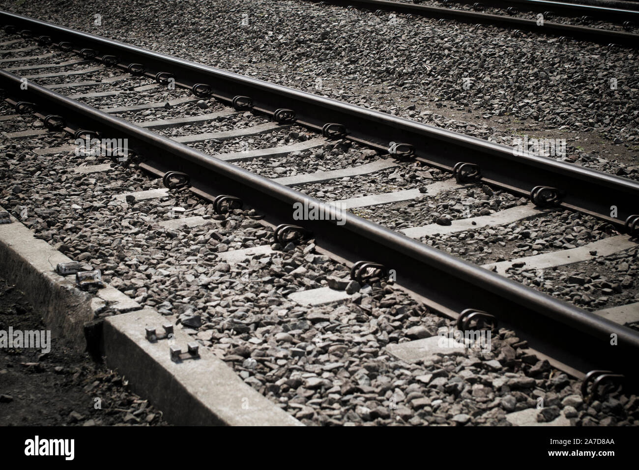 Close-up train rail track in a black and white picture Stock Photo - Alamy