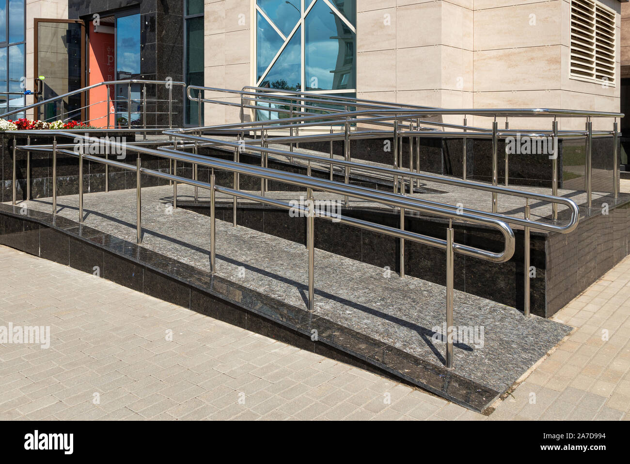 Wheelchair ramp of two uneven horizontal surfaces, street view, window ...