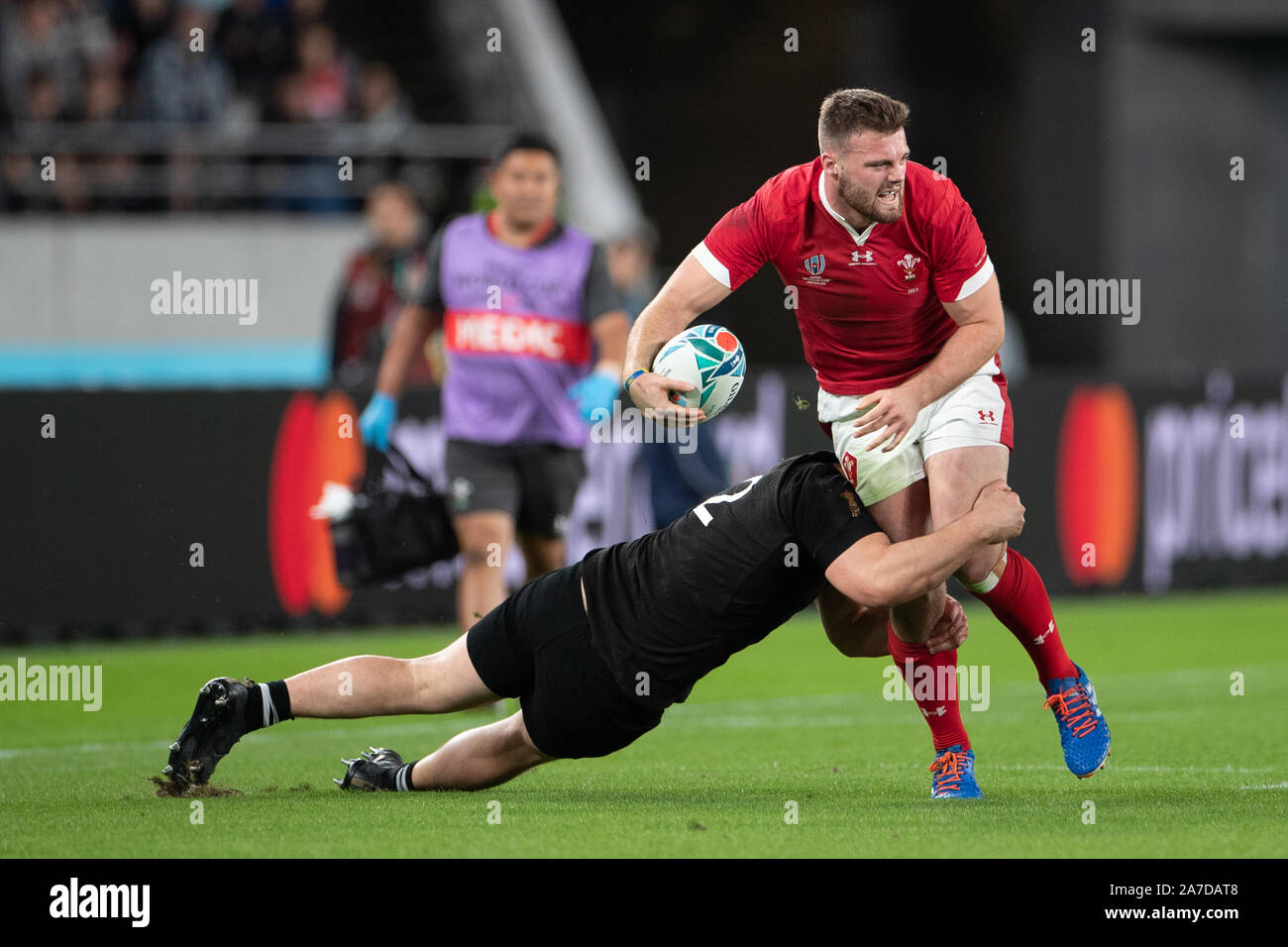 Owen Lane of Wales is tackled by Dane Coles of New Zealand during the ...