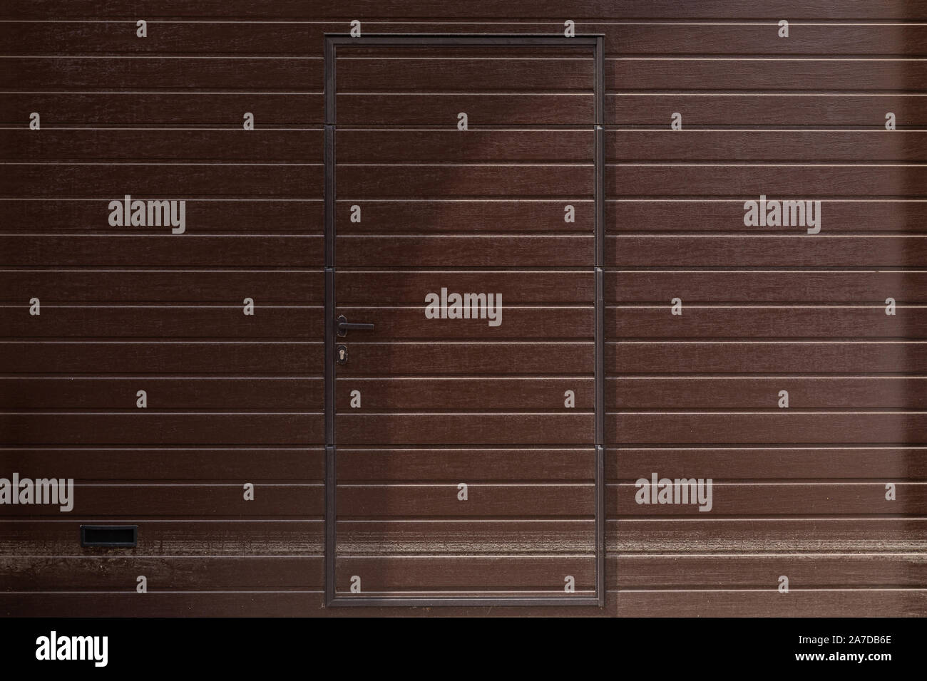 Doors in the color of the walls, walls patterned with wooden clapboard ...