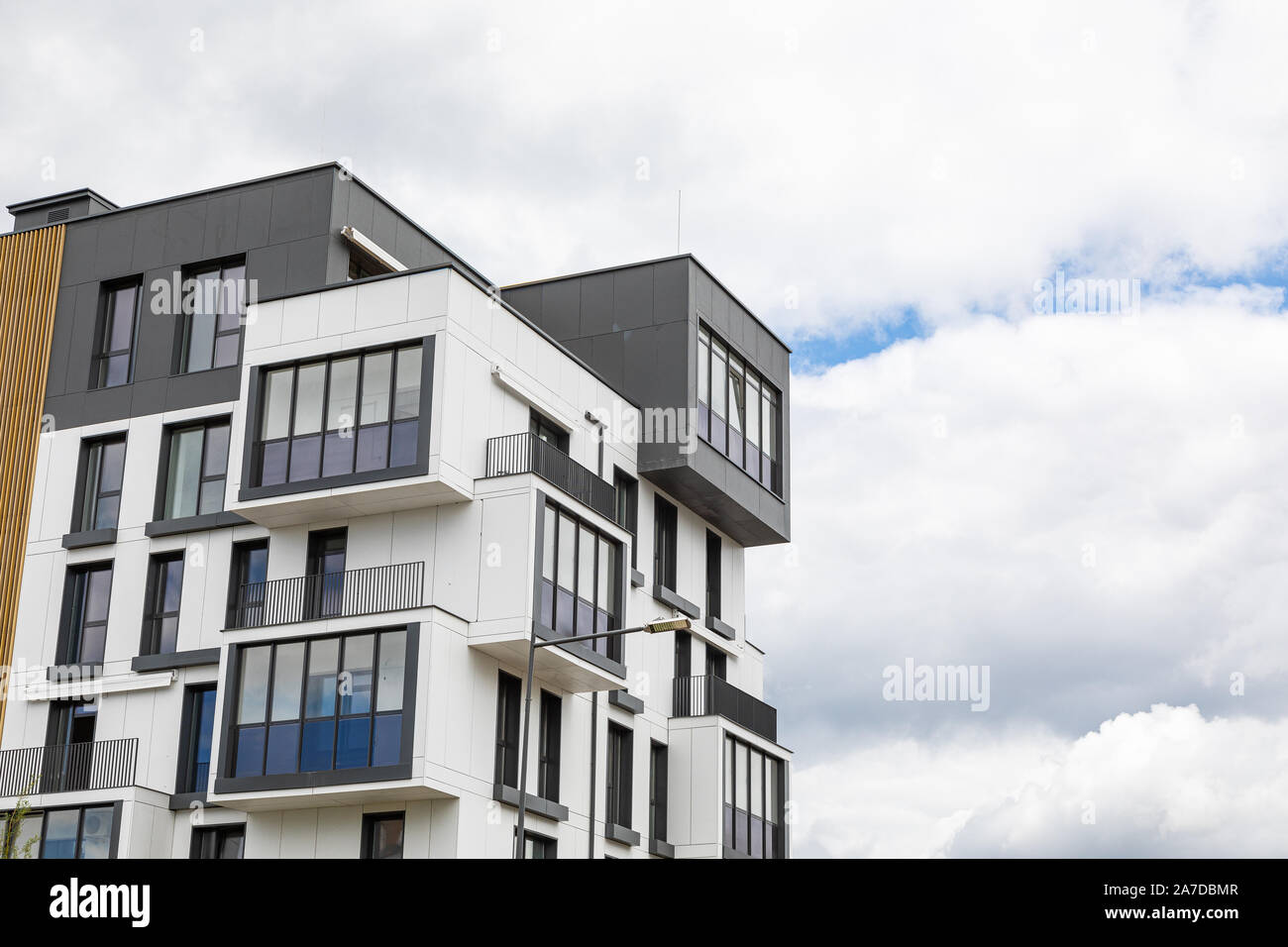 Outside view on upper floors of modern house building with balconies ...