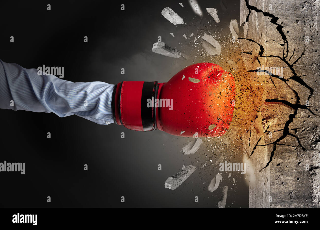 Big hand hits intense and breaks a crass stonewall Stock Photo - Alamy