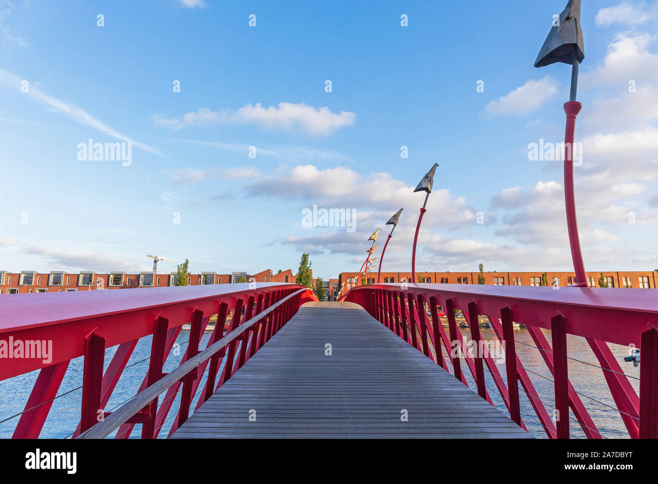 Red Python Bridge at Eastern Docklands in Amsterdam Stock Photo - Alamy