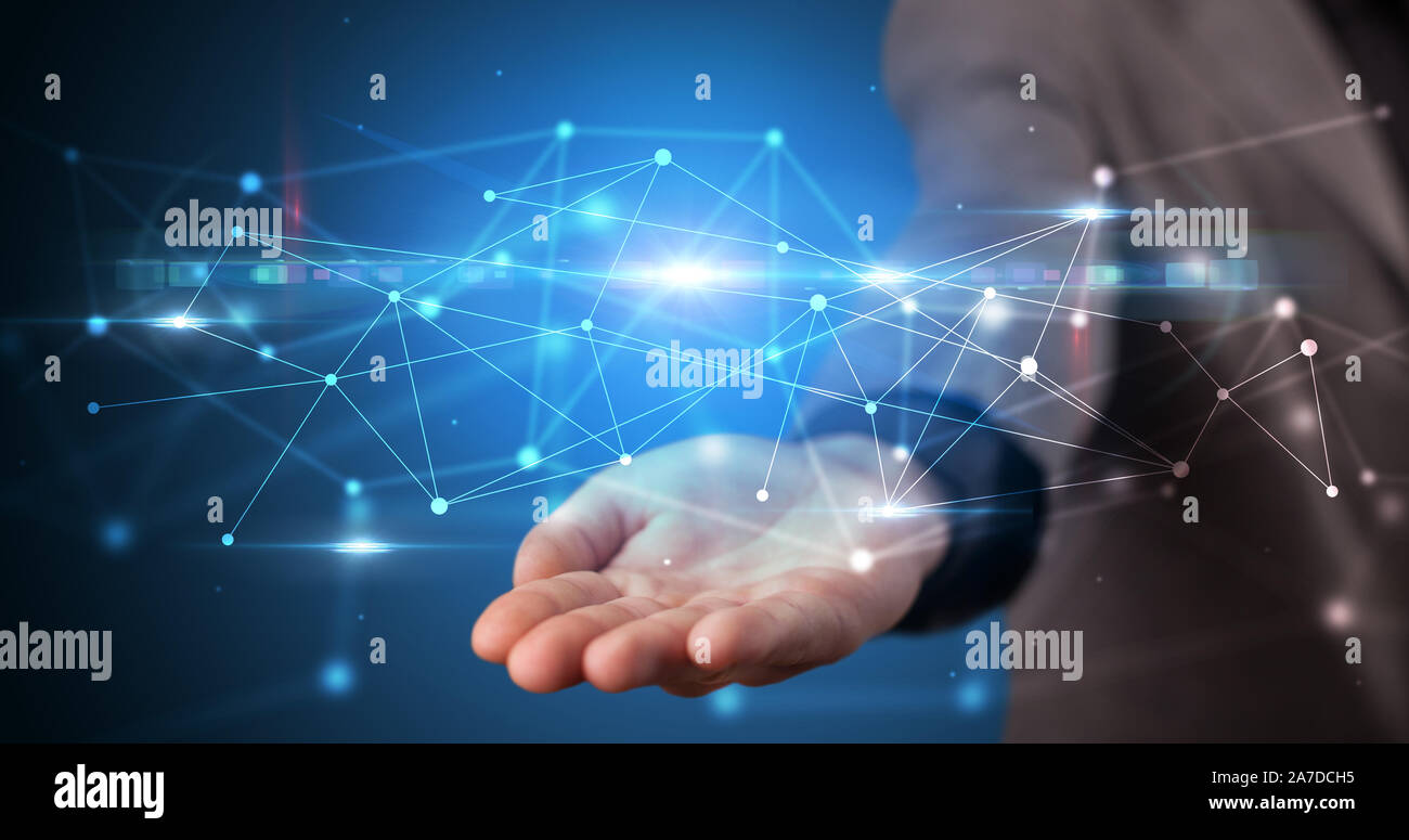 Handsome person holding hologram screen displaying modern cloud based ...