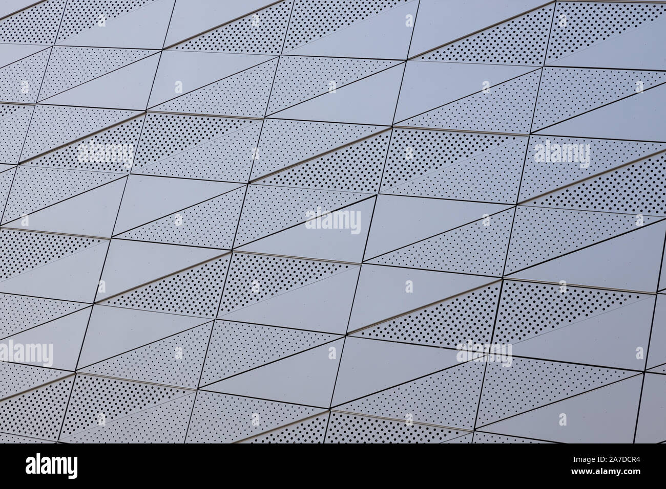 White surface of smooth wall with round openings Stock Photo - Alamy