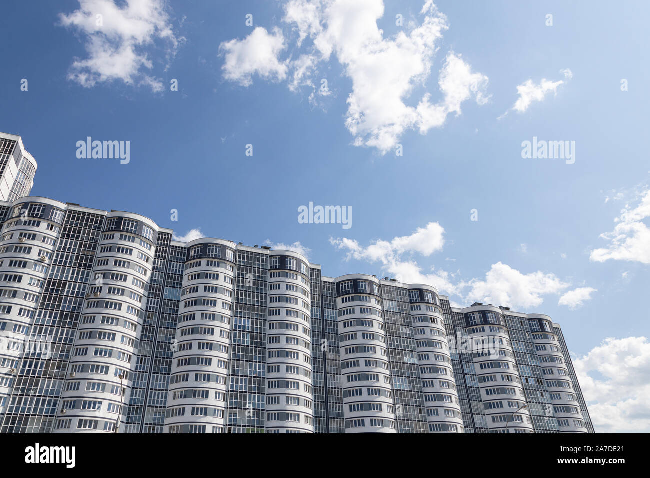 High building of tenement house with bulged walls against sky with ...