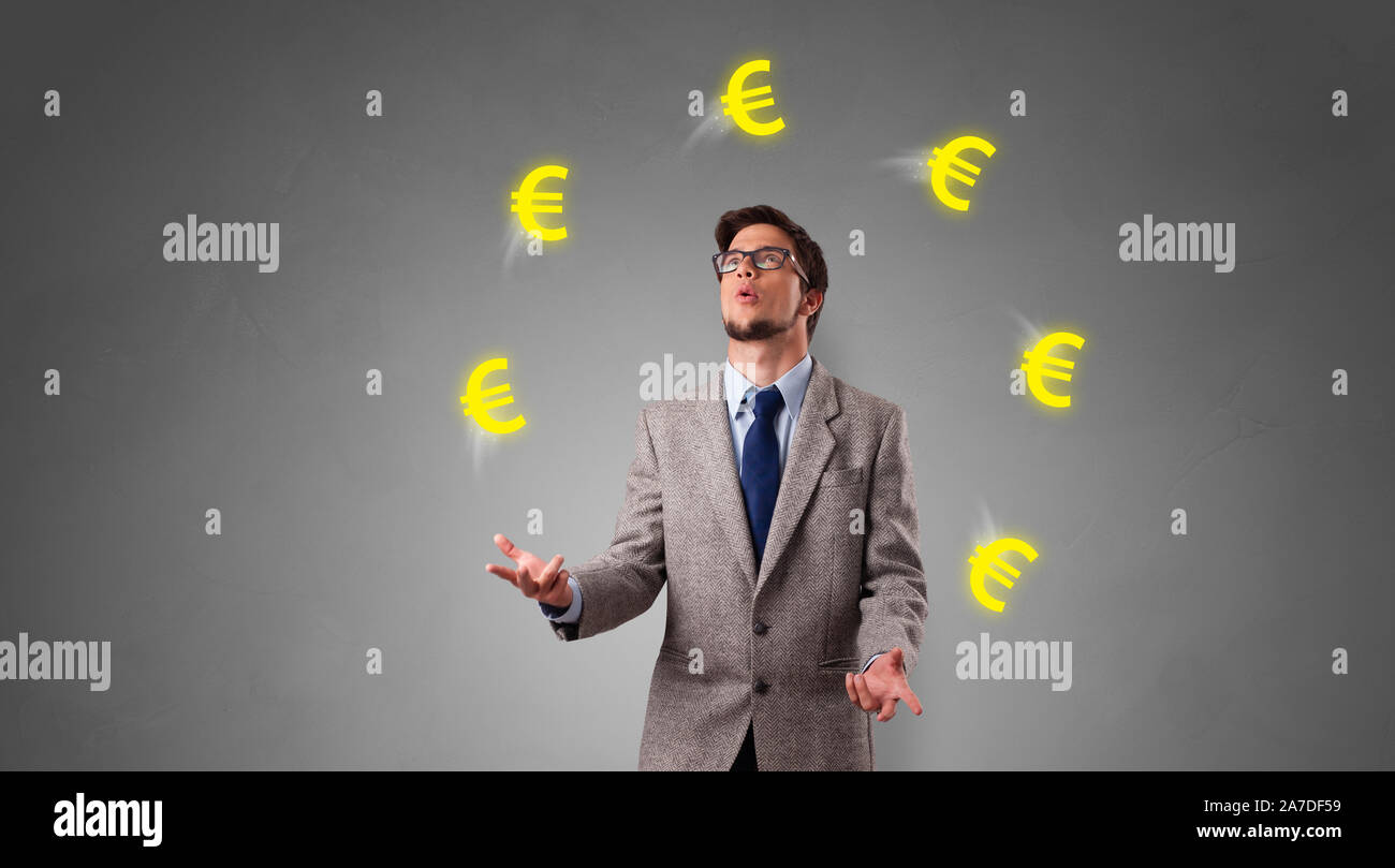 Young happy person juggle with euro symbol Stock Photo - Alamy