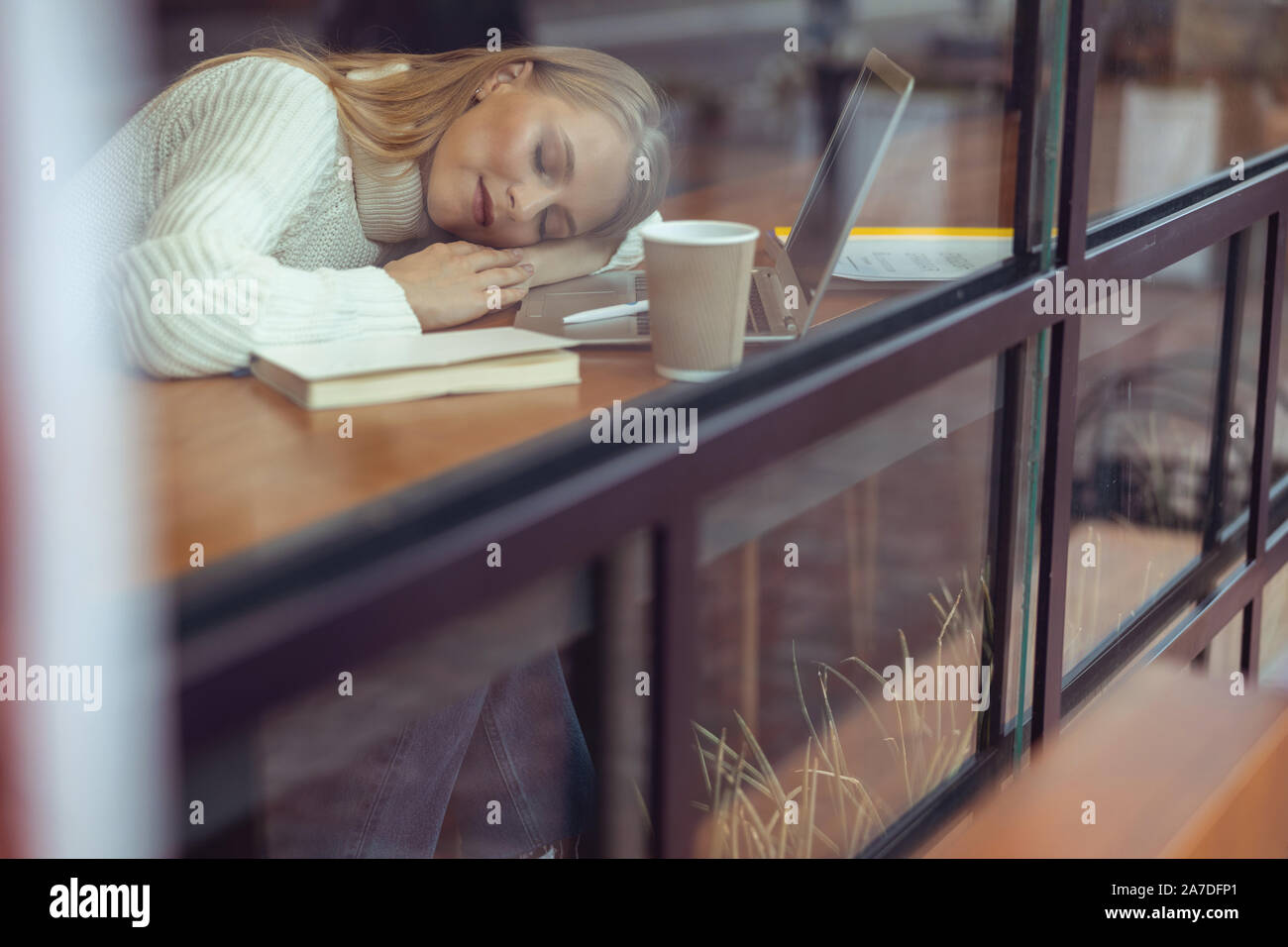 Girl napping on desk hi-res stock photography and images - Alamy