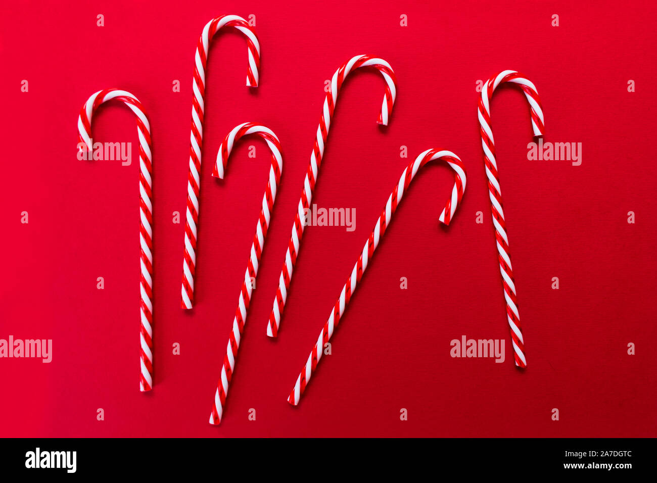 A lot of Christmas candies on a red background Stock Photo - Alamy
