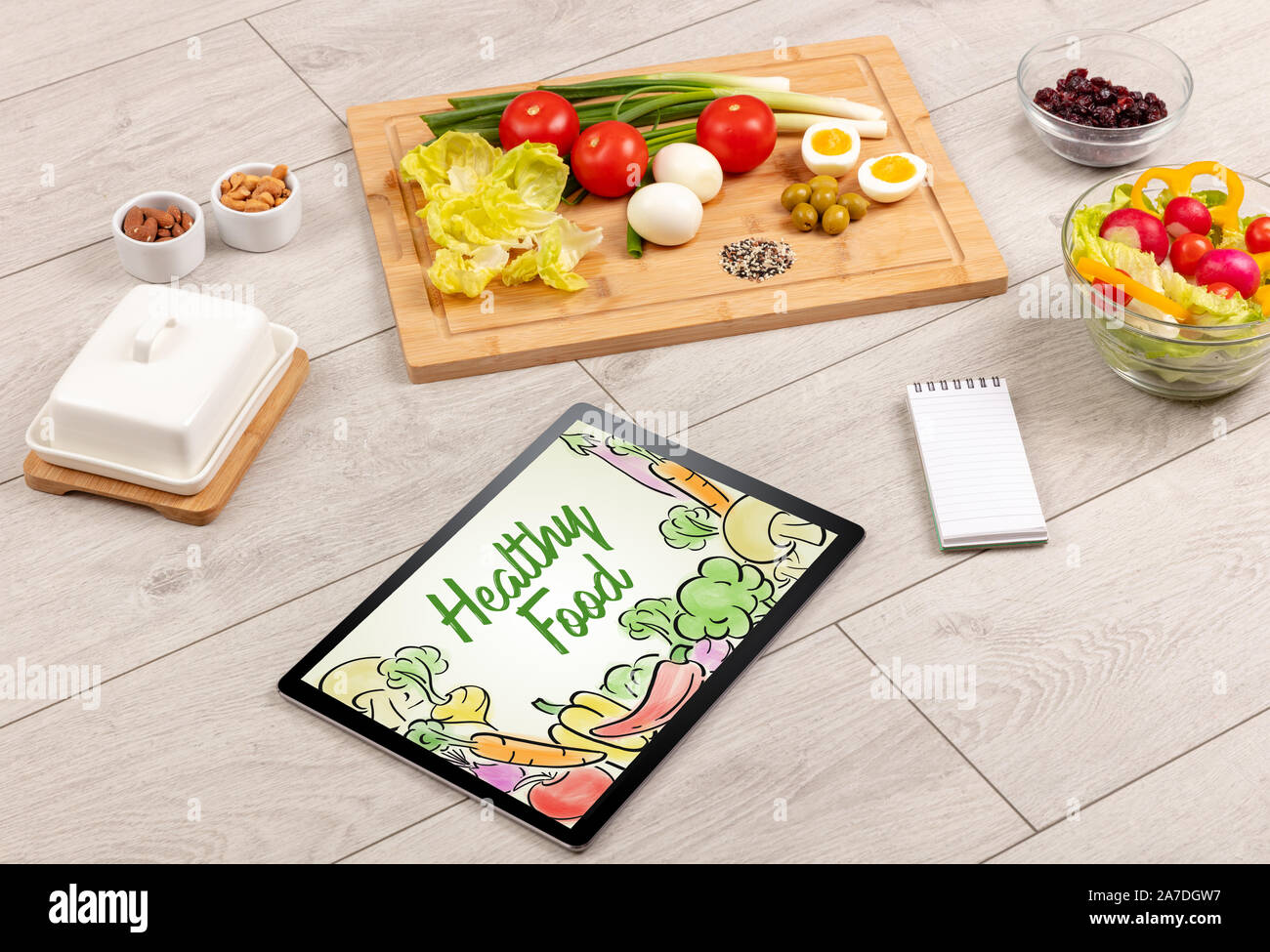 Healthy food composition with tablet Stock Photo - Alamy