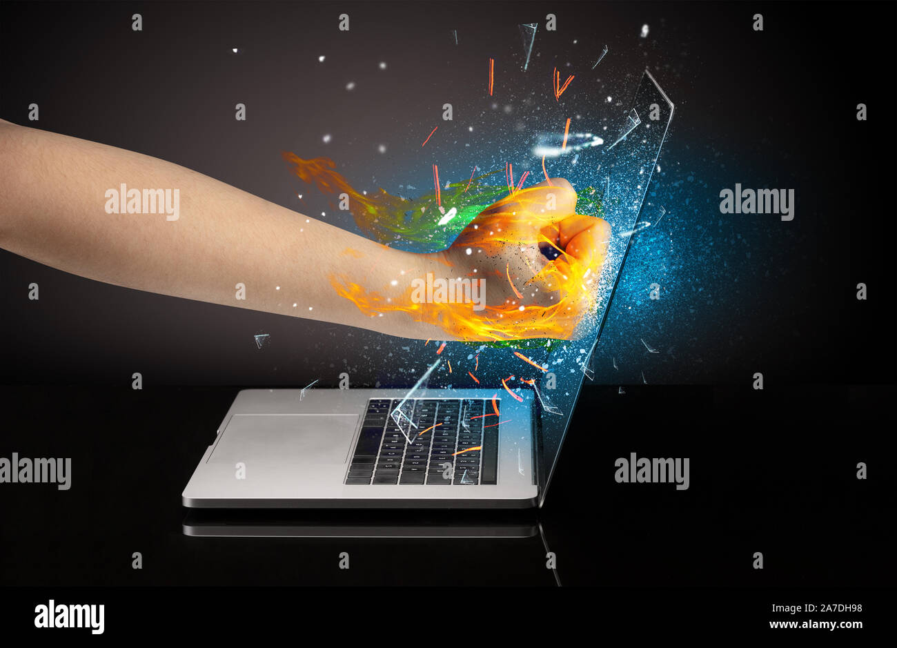 Firing hand hitting strongly laptop screen glass Stock Photo - Alamy