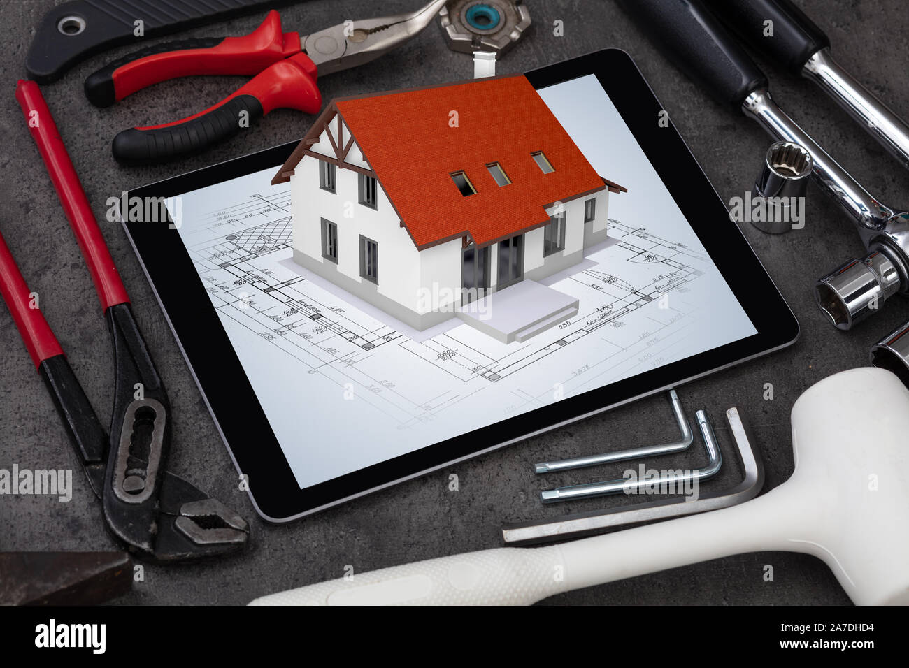 Tablet with construction tools and 3d home plan concept Stock Photo - Alamy
