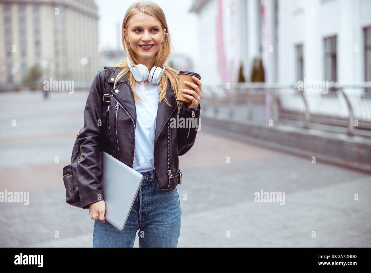 Young lady with a computer in her hand Stock Photo - Alamy