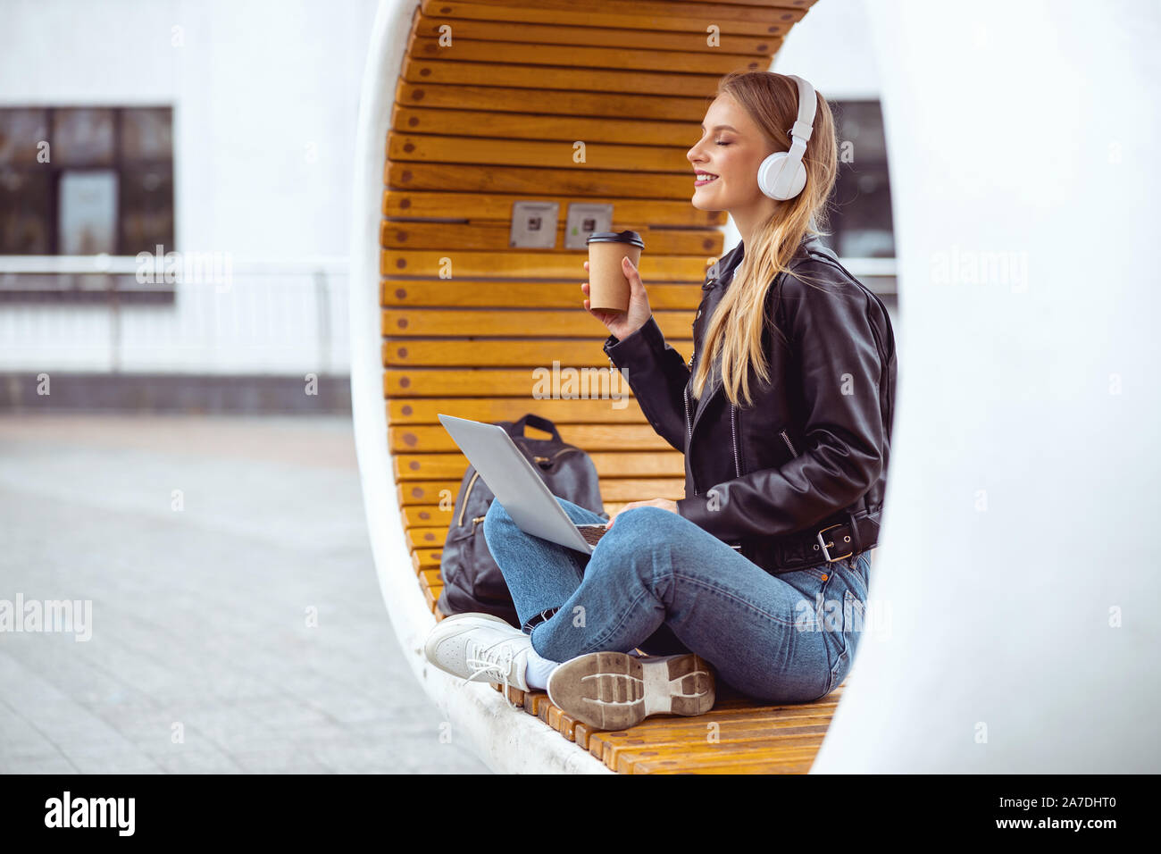 Pleased student girl taking a rest outside Stock Photo - Alamy