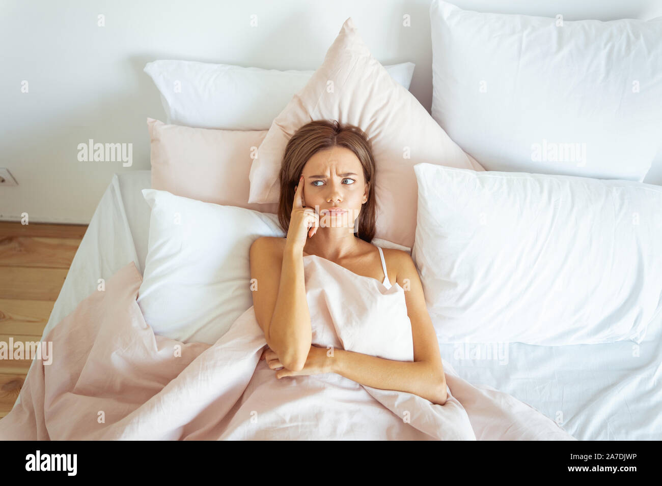 Young woman being deep in thoughts during morning Stock Photo - Alamy