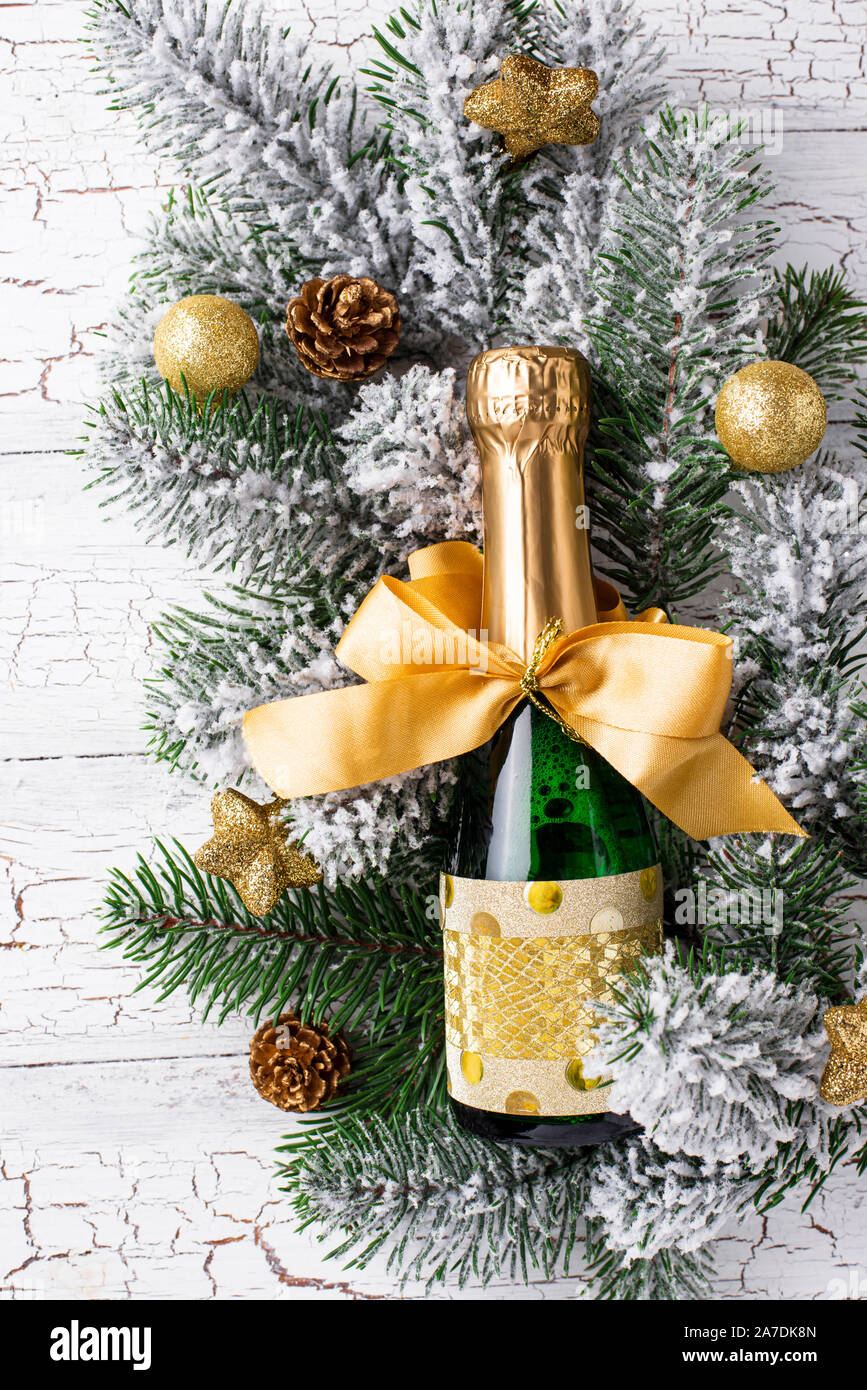 Bottle of champagne in a gold wrapper Stock Photo - Alamy