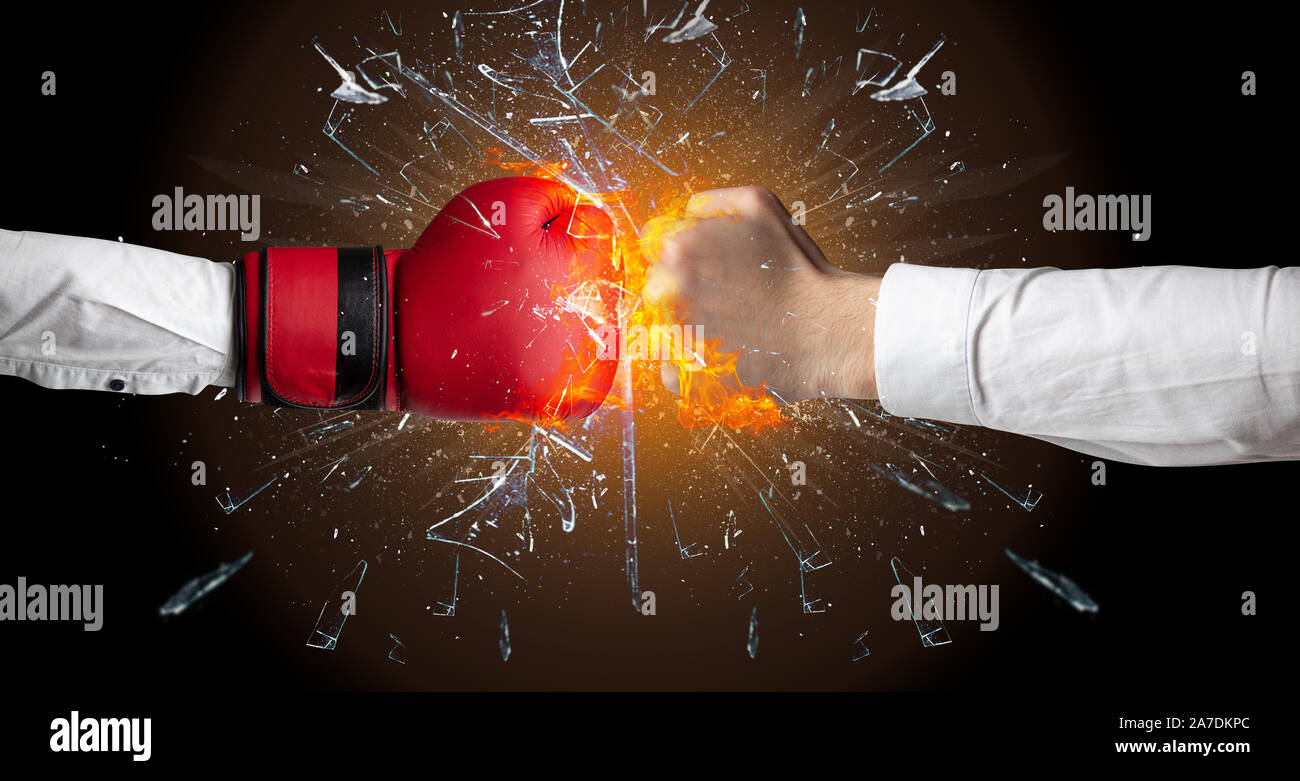 Two hands fighting and breaking a glass into small pieces Stock Photo ...