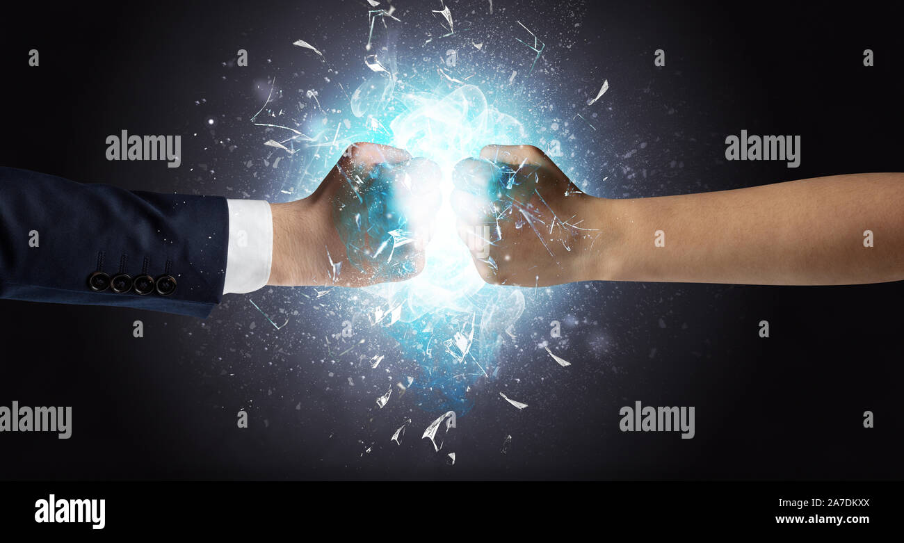 Two hands fighting and breaking glass into small pieces with blue light ...