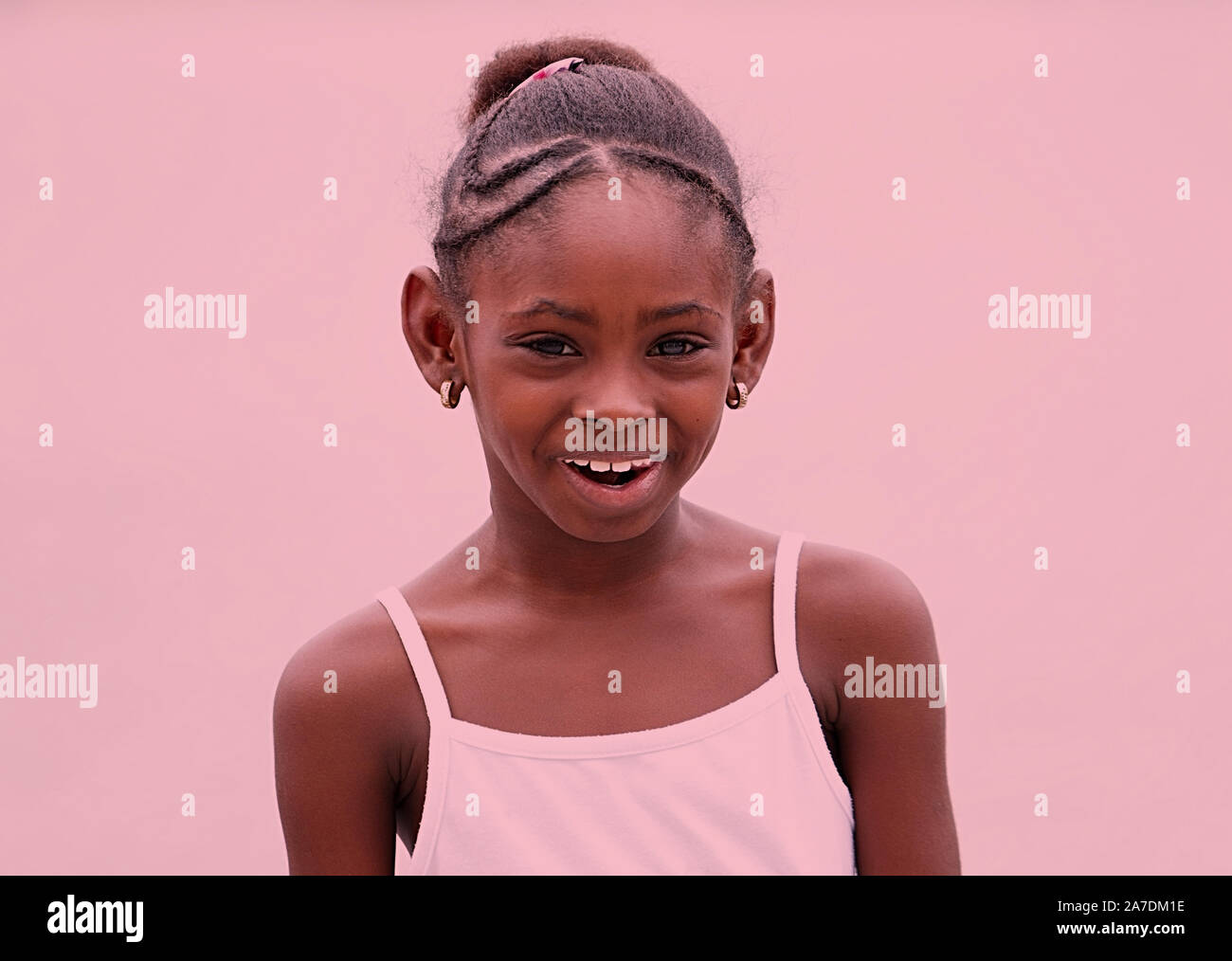 cuban girl on pink background Stock Photo - Alamy