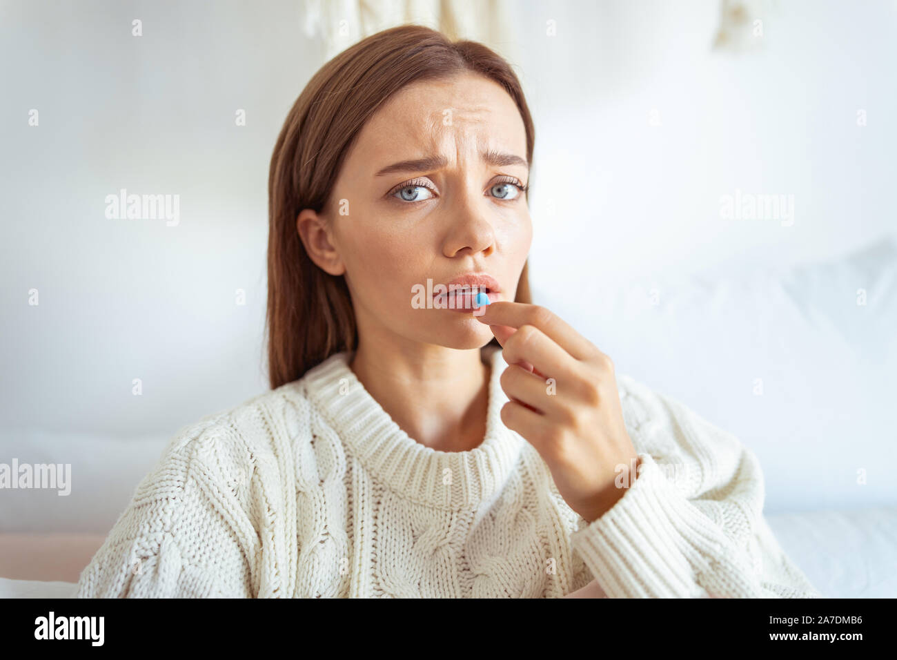 Emotional young female person having medical treatment Stock Photo - Alamy