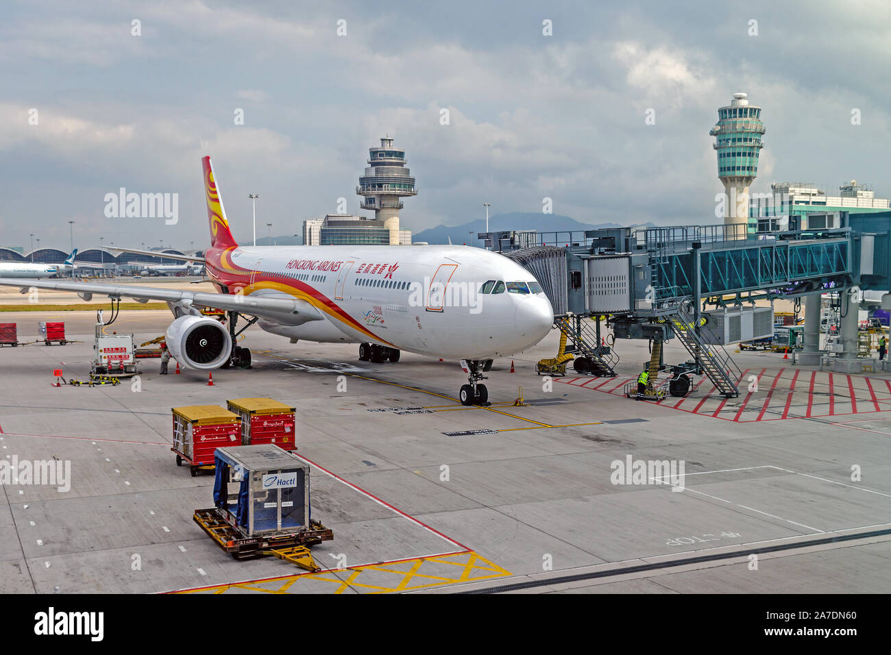 Passenger plane at airport at the terminal gate. Preparing for boarding ...
