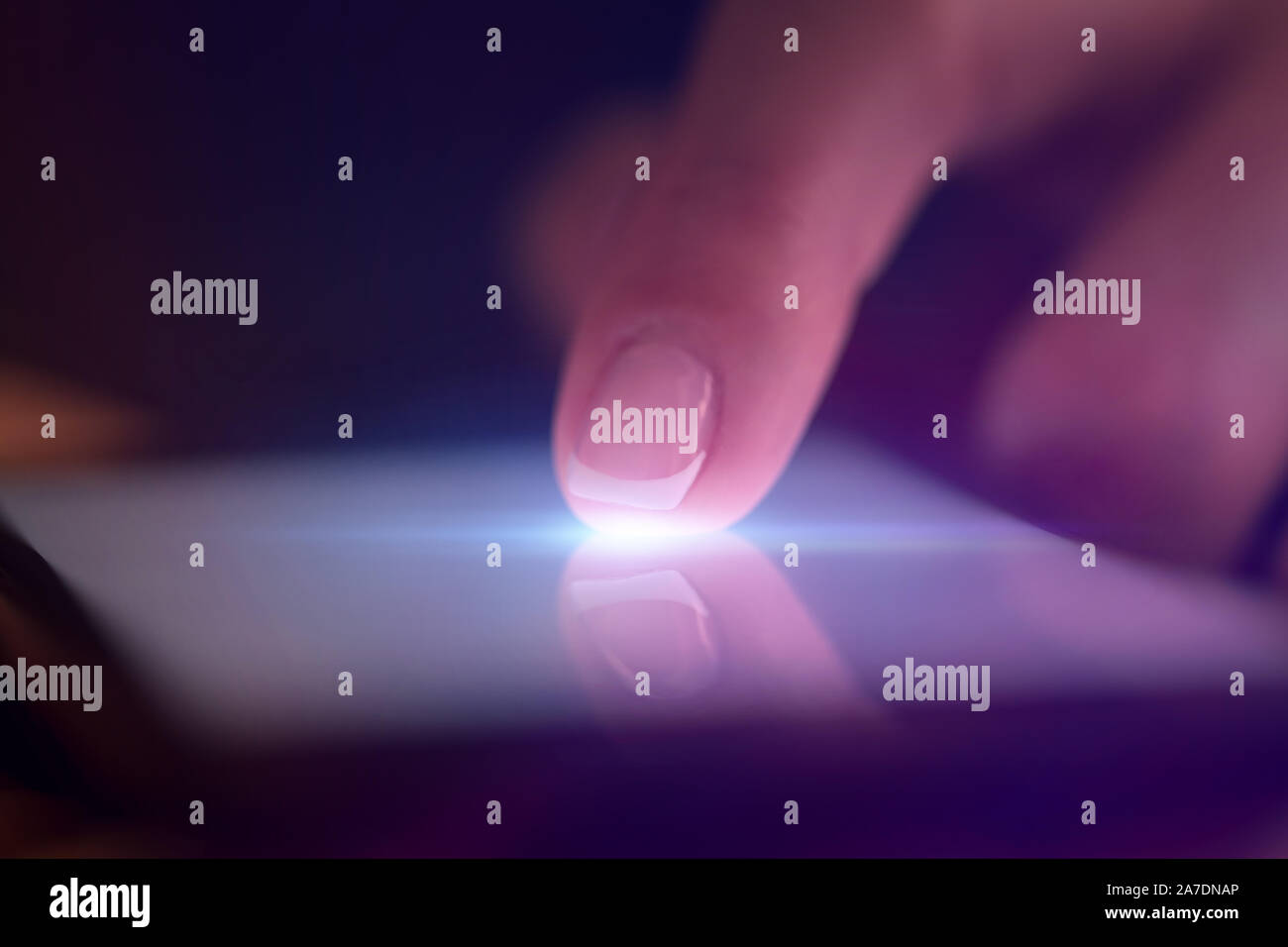 Finger touching phone with dark background with copyspace Stock Photo ...