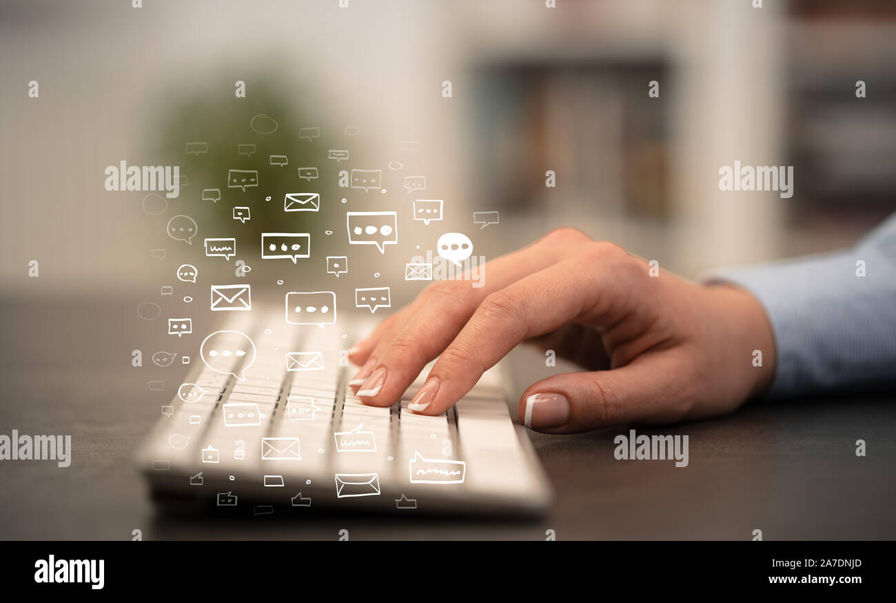 Business woman hand typing on keyboard with chat icons around Stock ...