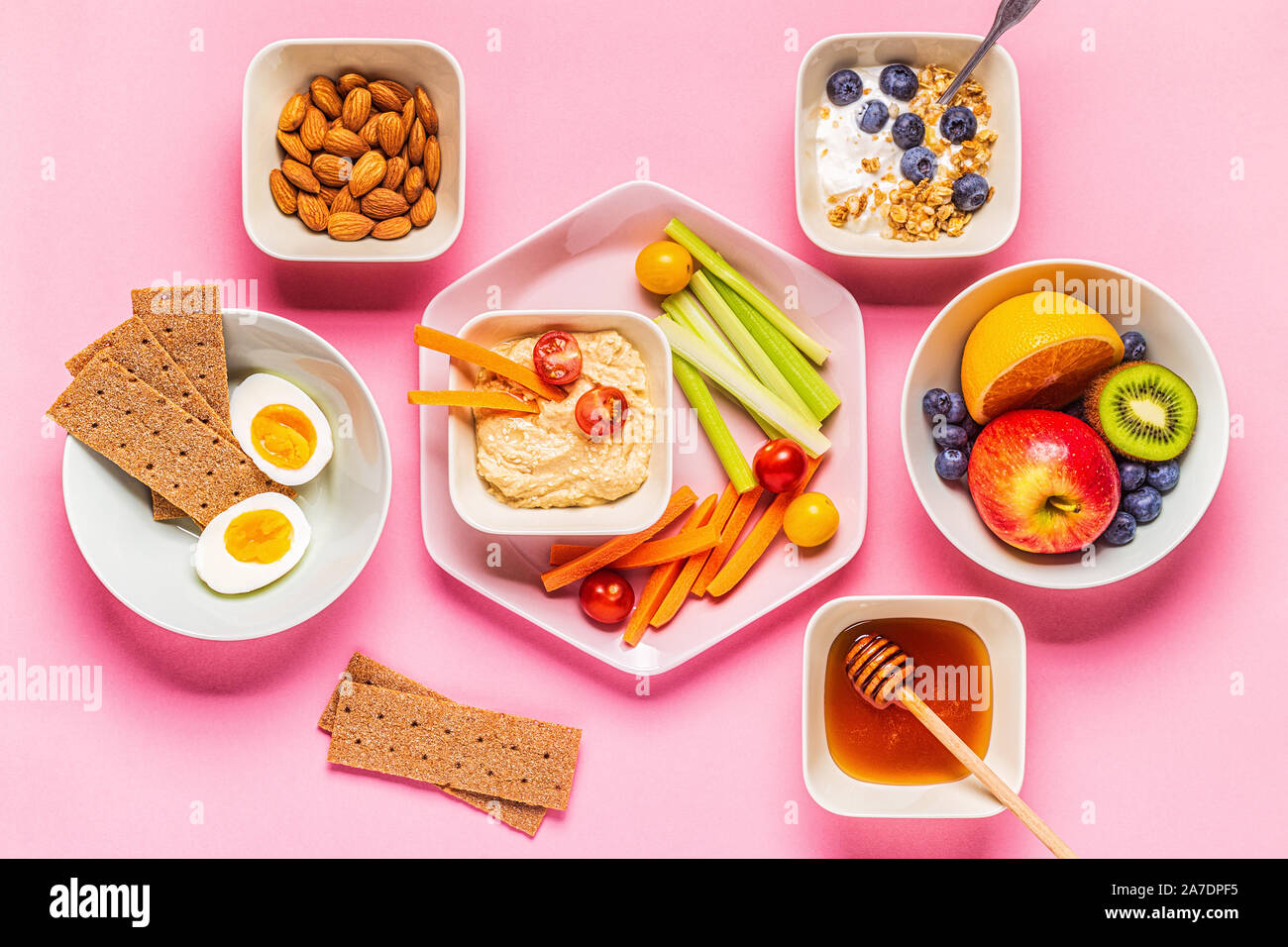 Healthy snack on a pastel background, top view Stock Photo - Alamy