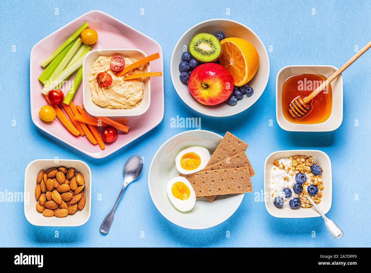 Healthy snack on a pastel background, top view Stock Photo - Alamy