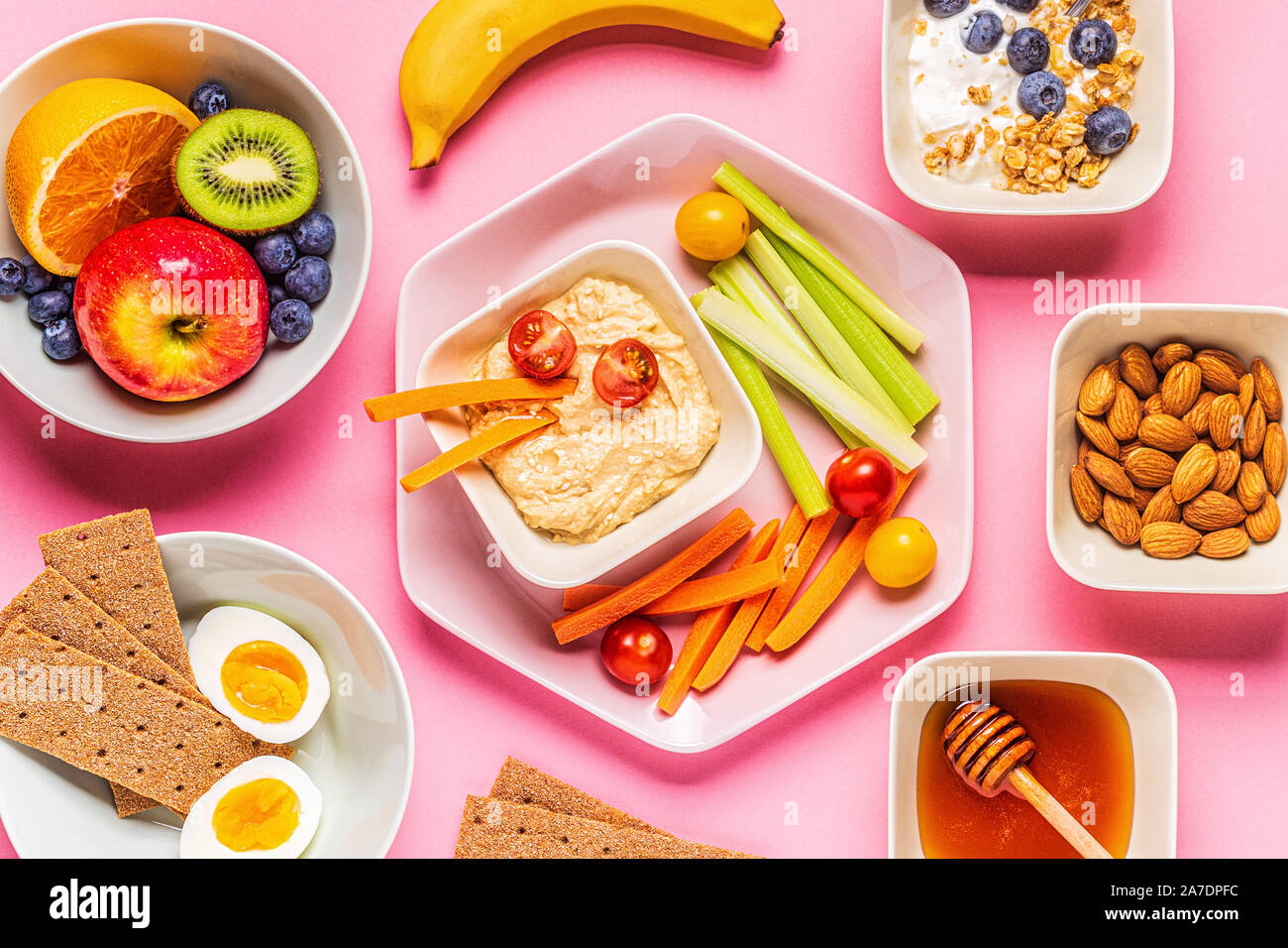 Healthy snack on a pastel background, top view Stock Photo - Alamy