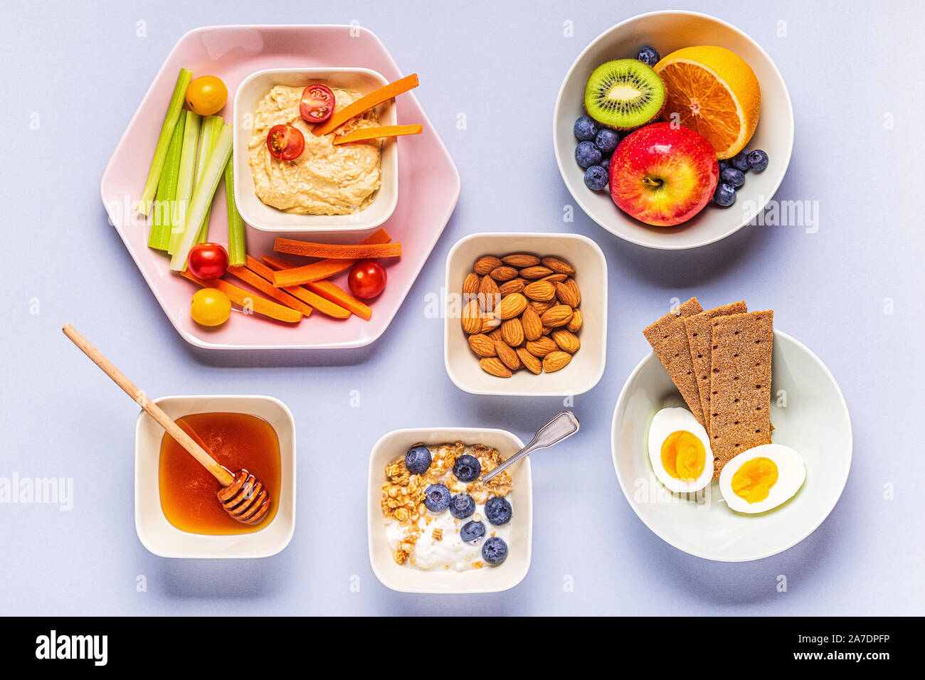 Healthy snack on a pastel background, top view Stock Photo - Alamy