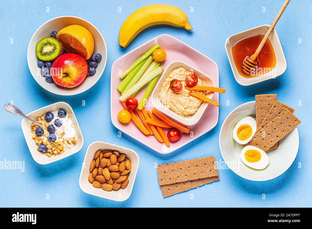 Healthy snack on a pastel background, top view Stock Photo - Alamy