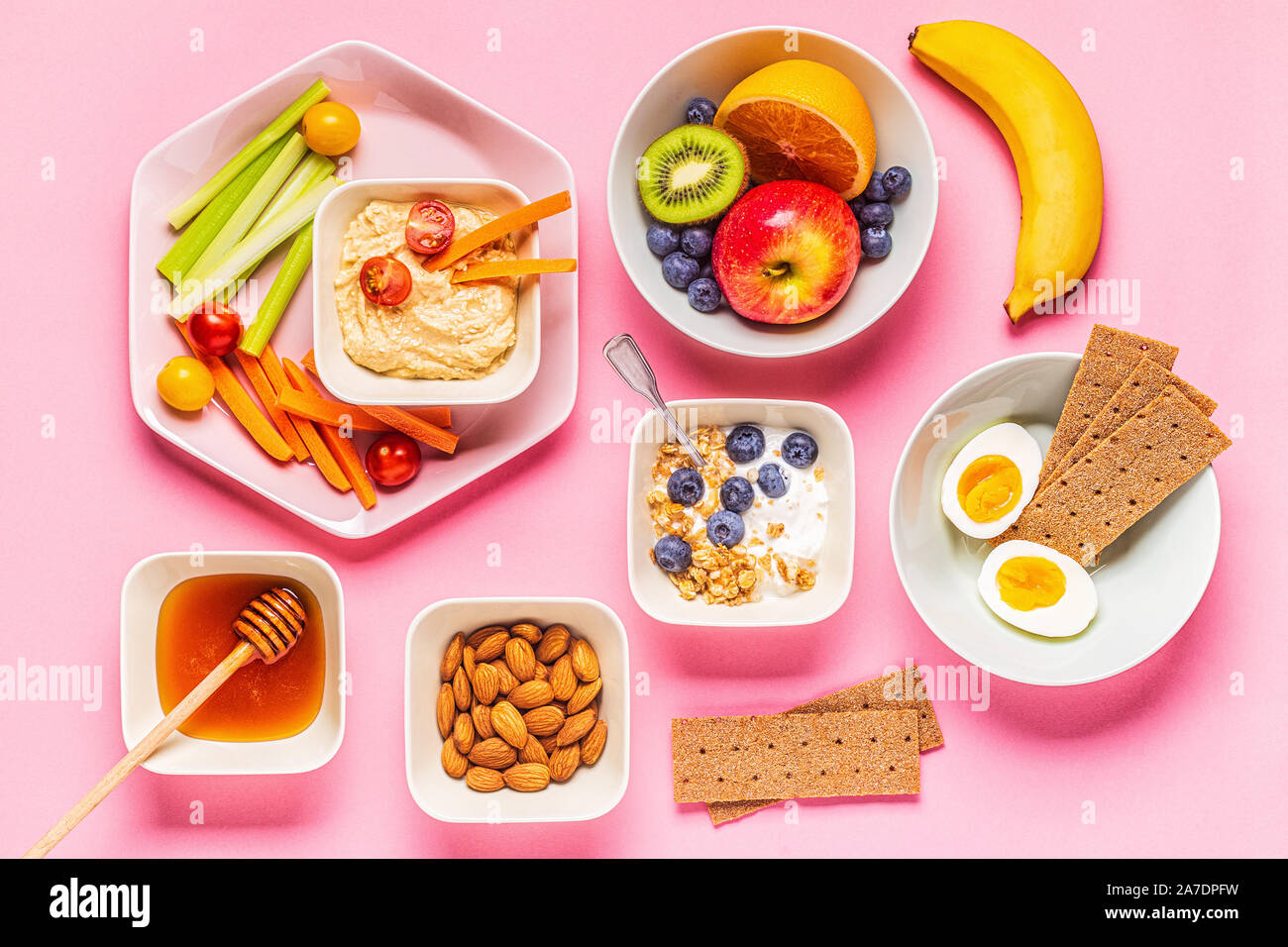 Healthy snack on a pastel background, top view Stock Photo - Alamy