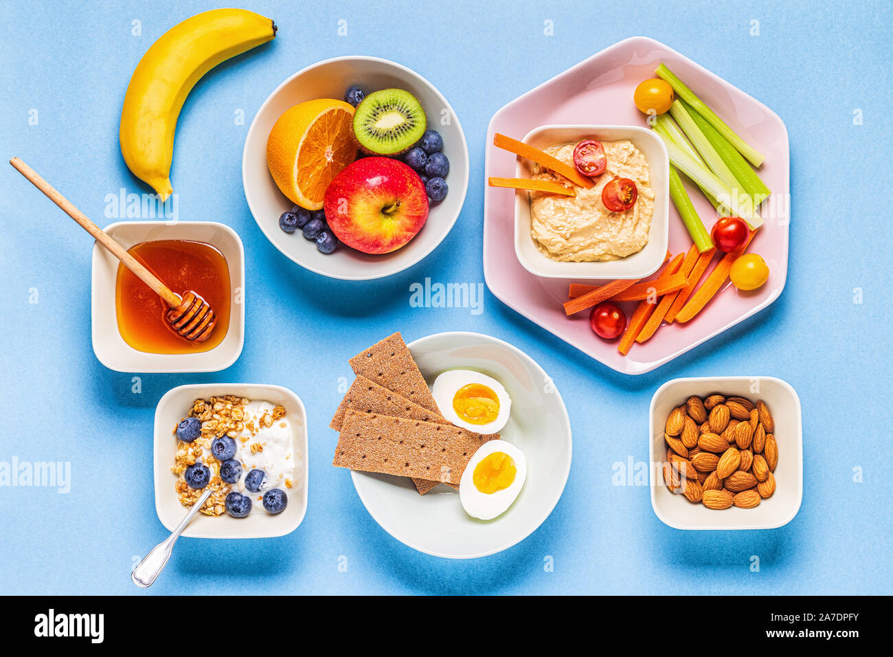 Healthy snack on a pastel background, top view Stock Photo - Alamy