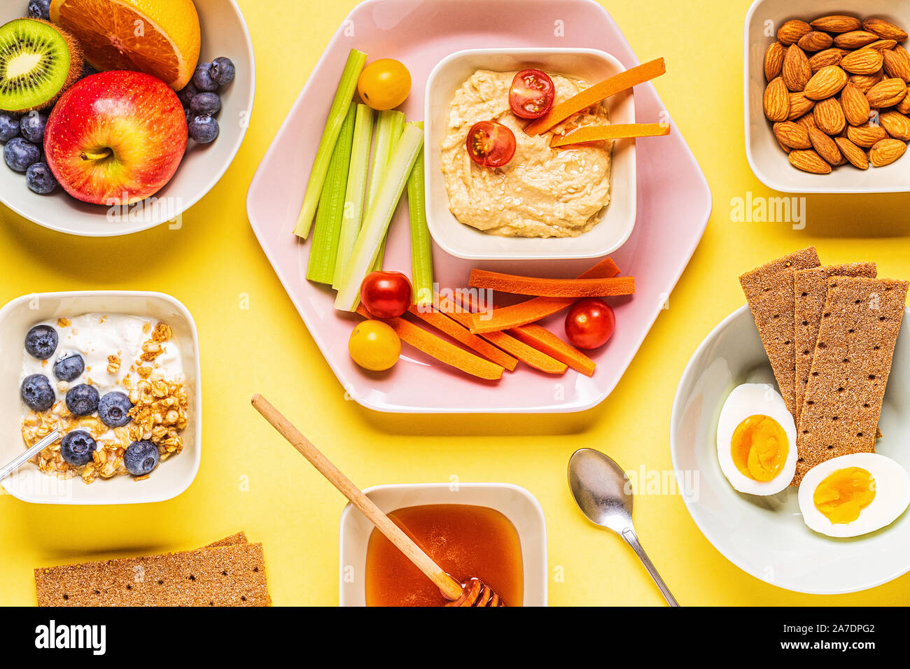 Healthy snack on a pastel background, top view Stock Photo - Alamy