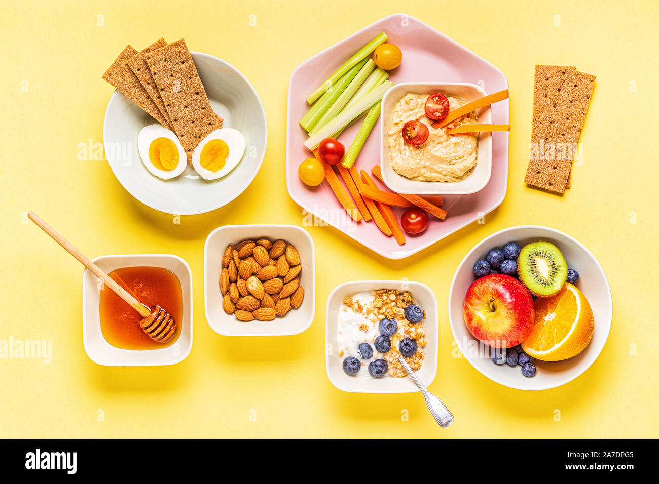 Healthy snack on a pastel background, top view Stock Photo - Alamy