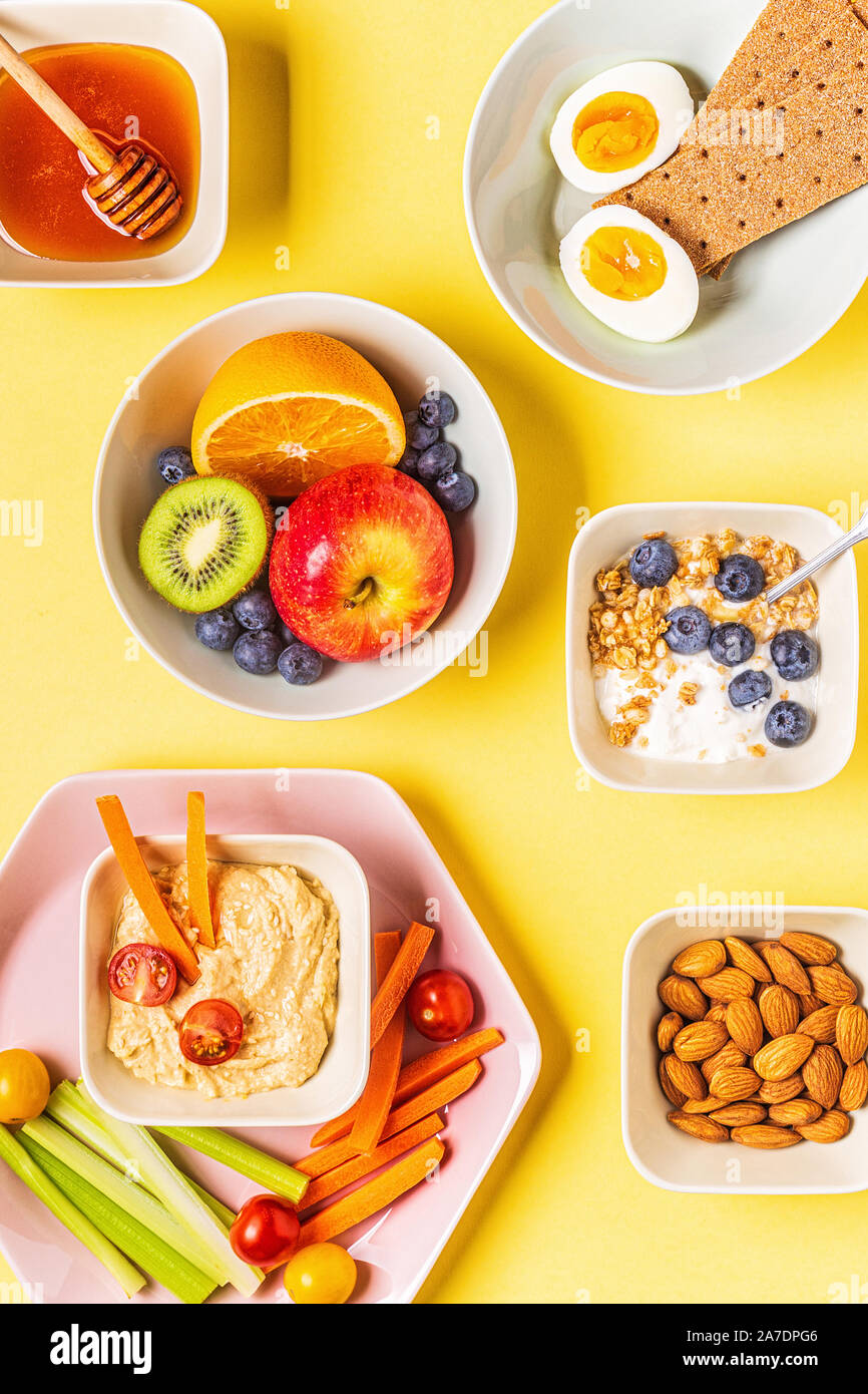 Healthy snack on a pastel background, top view Stock Photo - Alamy