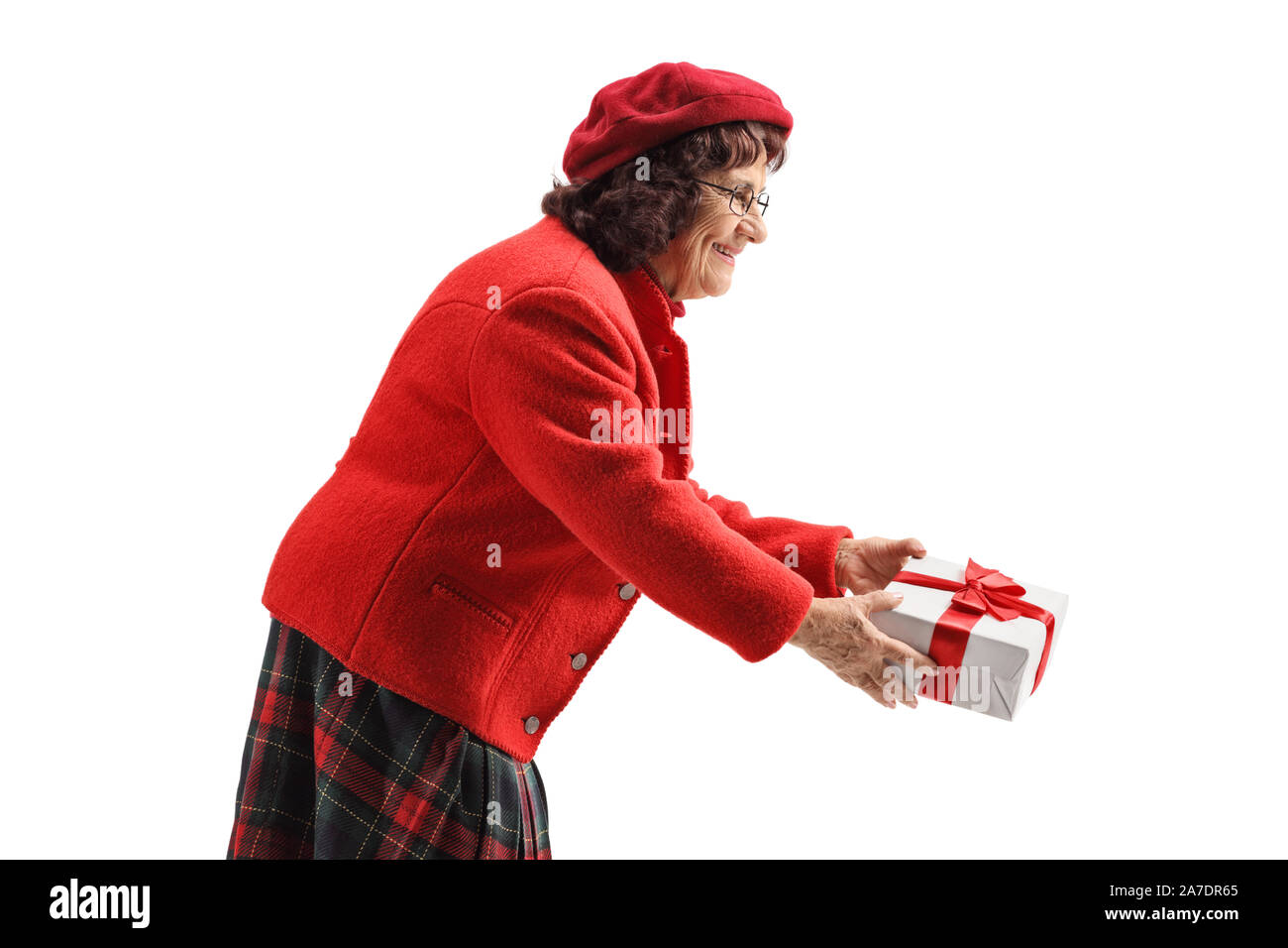 Elderly lady giving a present isolated on white background Stock Photo ...
