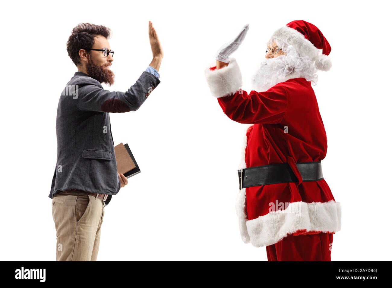 Man high-fiving Santa Claus isolated on white background Stock Photo ...