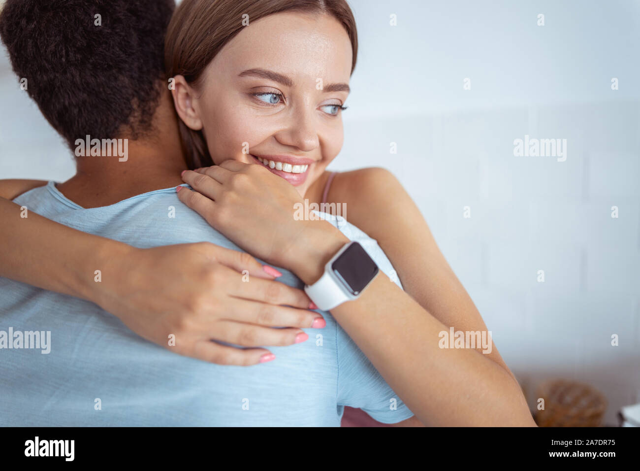 Attractive young female caressing her international friend Stock Photo ...