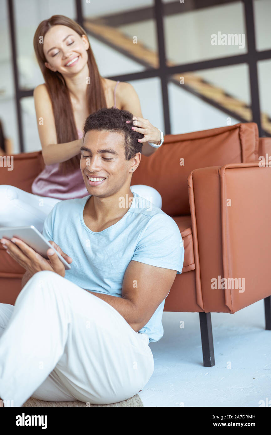 Handsome international male is enjoying head massage Stock Photo - Alamy