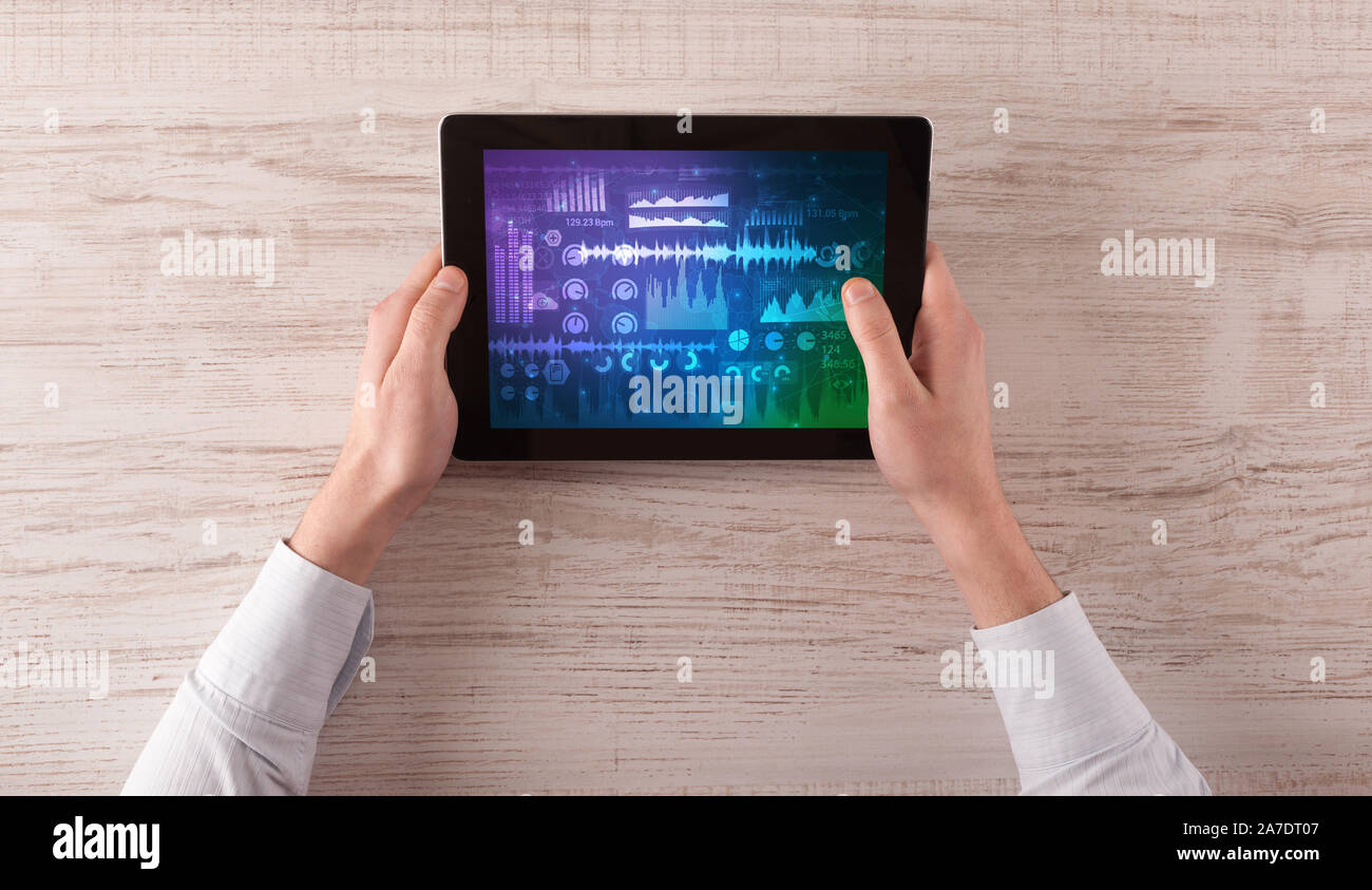 Hand touching tablet with waveforms and sound design concept Stock ...