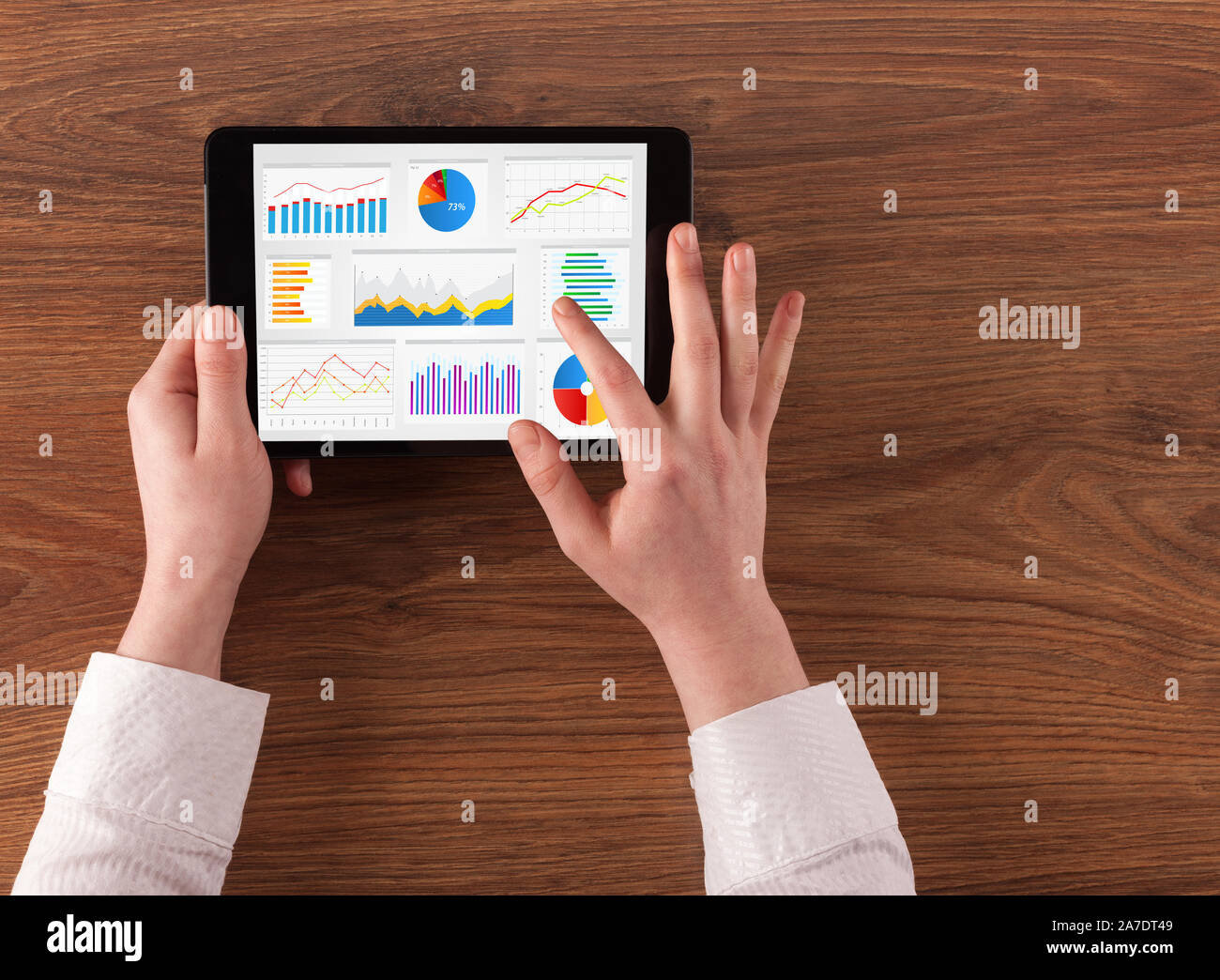 Hand making diagrams and charts on tablet Stock Photo - Alamy
